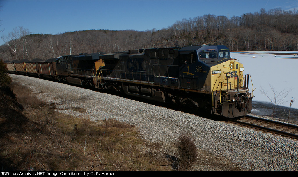 CSXT 1 leads another coal train east past the snowy, ice-covered Reusens Dam pond.